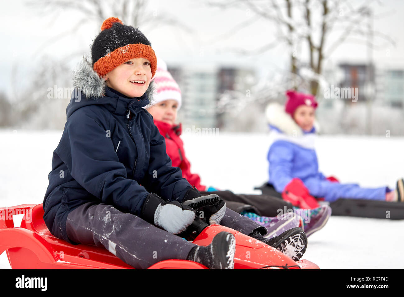 Kids on sleds hi-res stock photography and images - Alamy