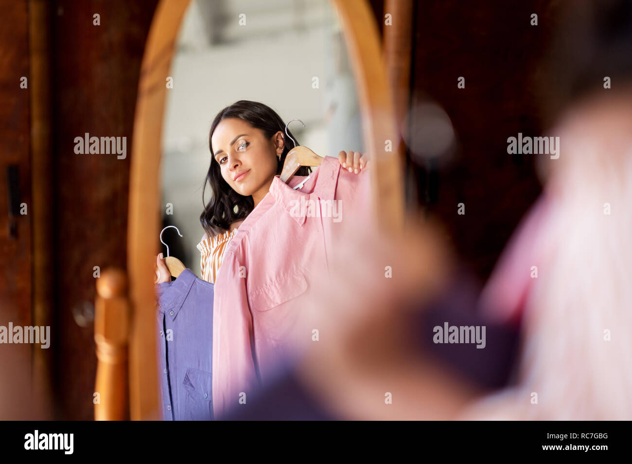 woman with dress at vintage clothing store mirror Stock Photo - Alamy