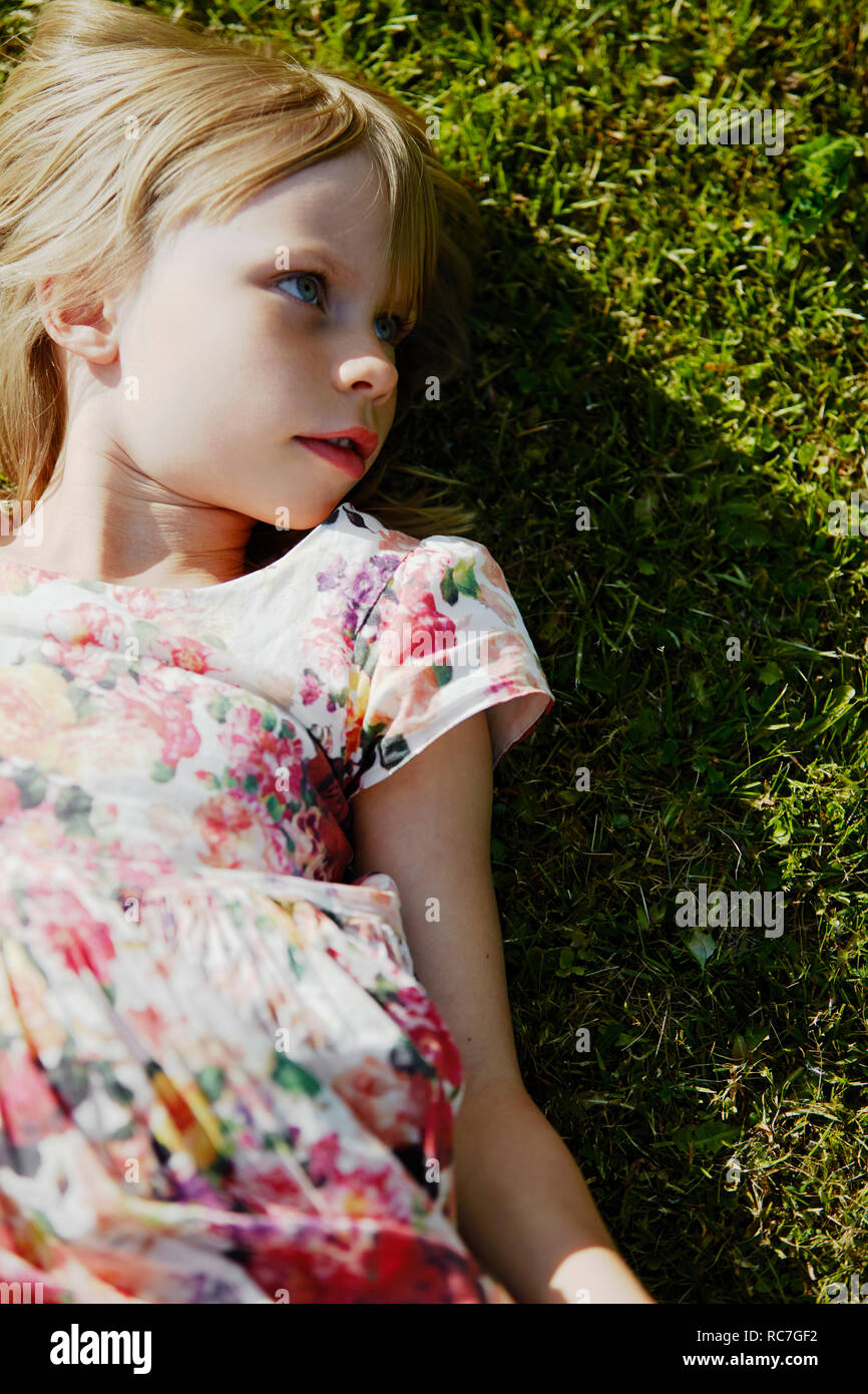 Girl lying grass field hi-res stock photography and images - Alamy