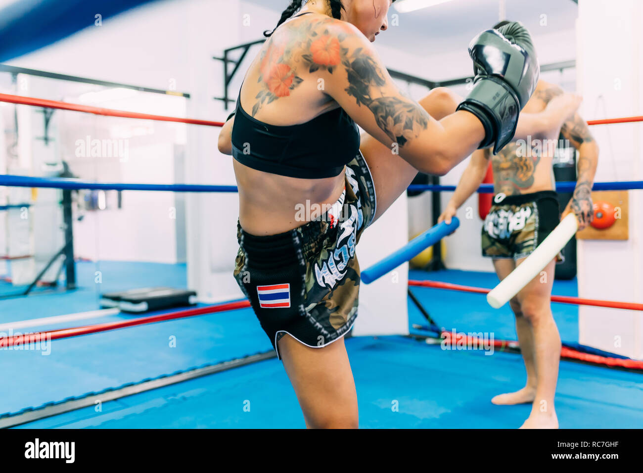 Male and female boxers working out in boxing ring Stock Photo - Alamy