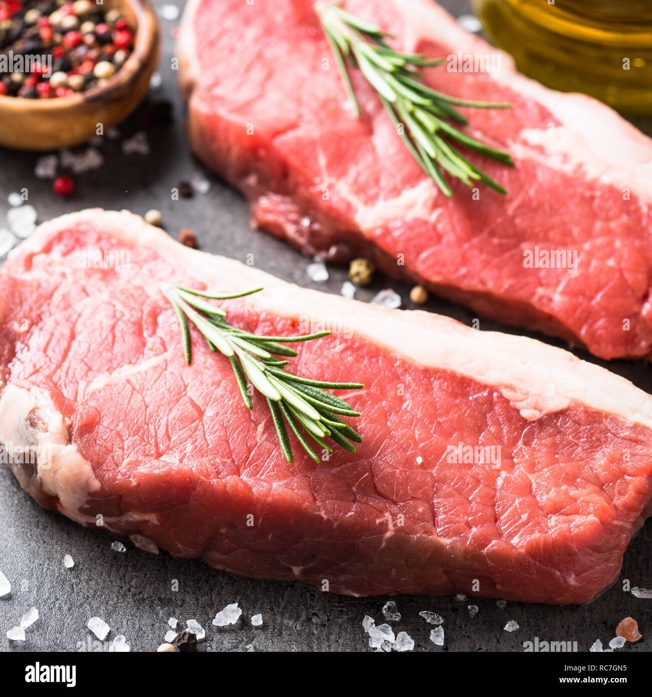 Raw beef striploin steak Stock Photo - Alamy