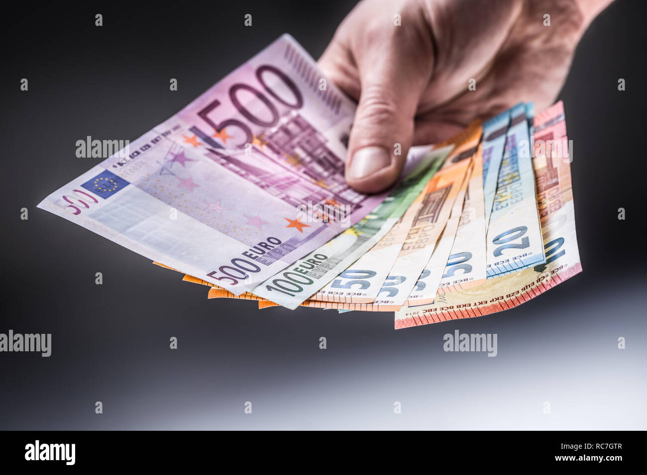 Euro banknotes in hands hi-res stock photography and images - Alamy