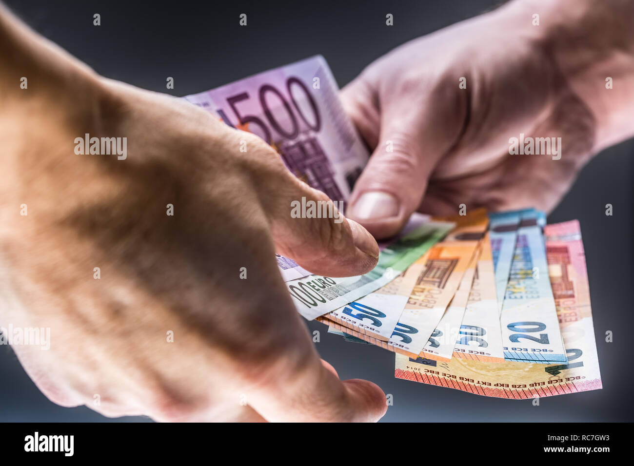 Hand giving money other hands hi-res stock photography and images - Alamy