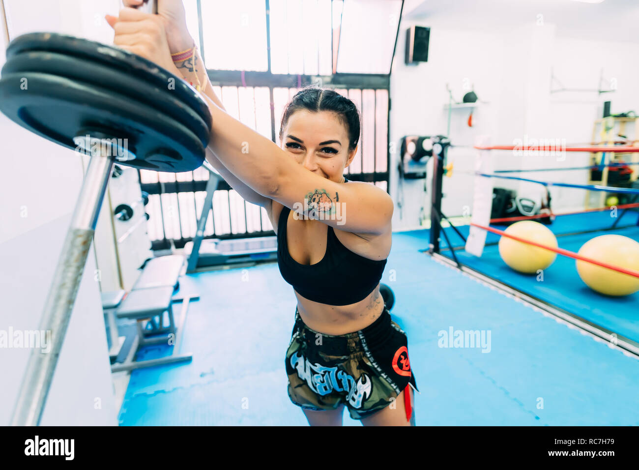 Female boxer lifting weights Stock Photo - Alamy