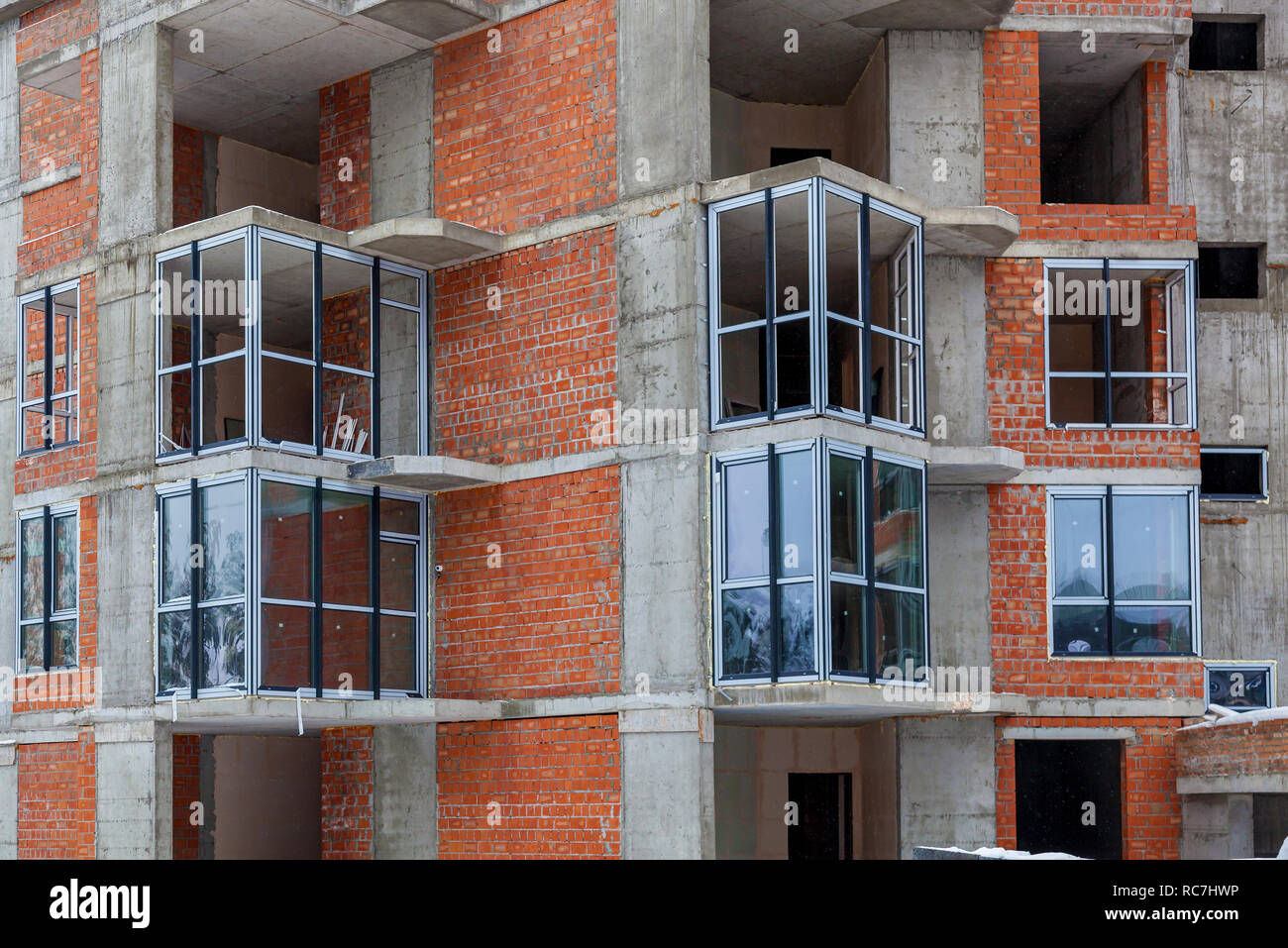 Brick house from a red brick, construction area construction of multi ...
