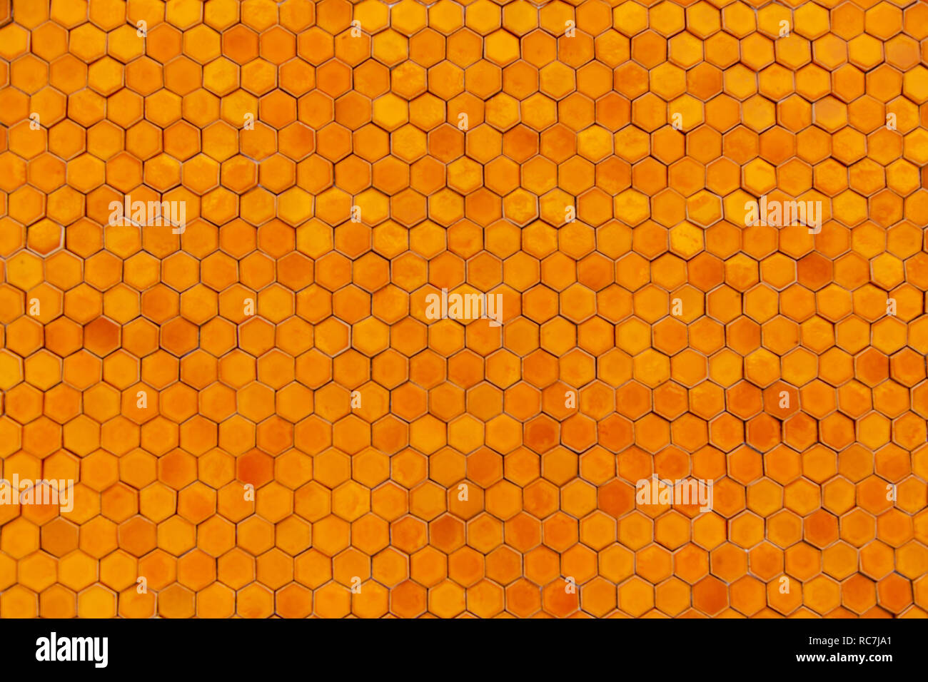 Background texture of a beehive wax cell cross section. Orange ...