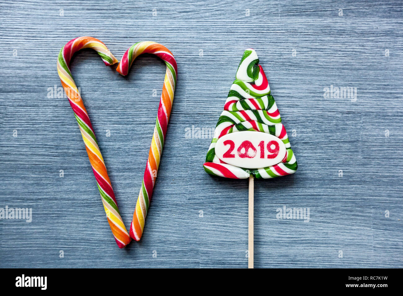 Colored candy lollipops New Year's sweets on a blue background ...