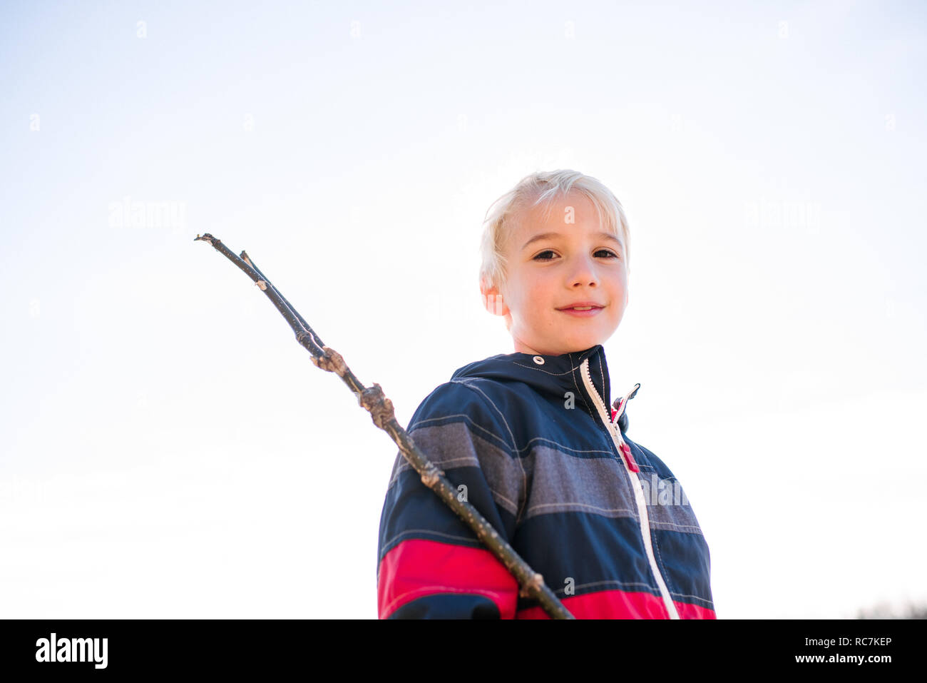 Boy with stick hi-res stock photography and images - Alamy