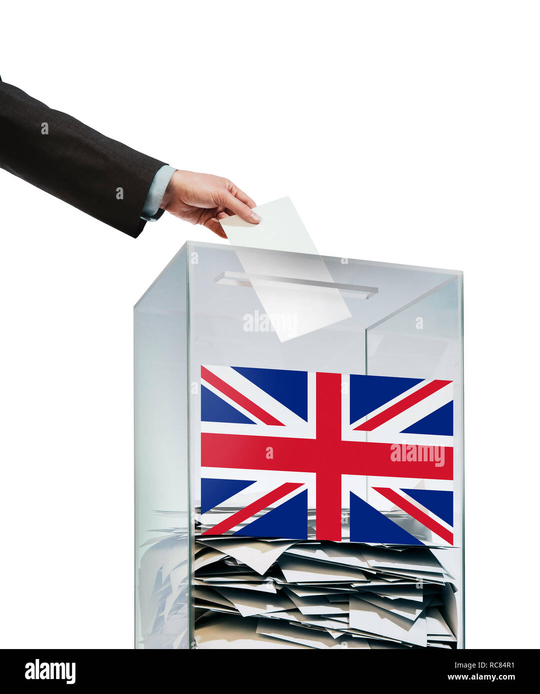 Hand inserting paper ballot in clear ballot box with union jack flag ...