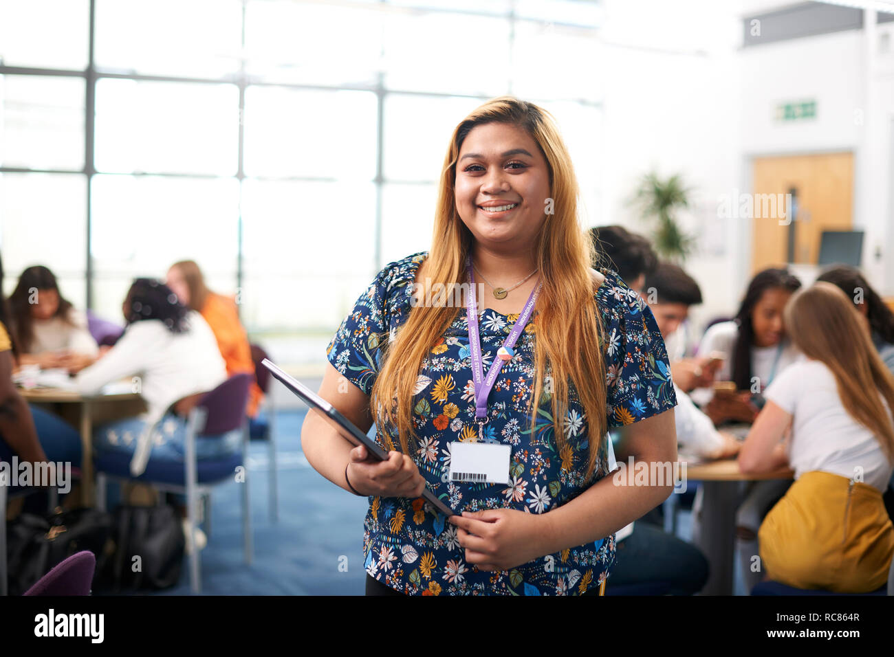 Young female higher education student in college classroom, portrait ...
