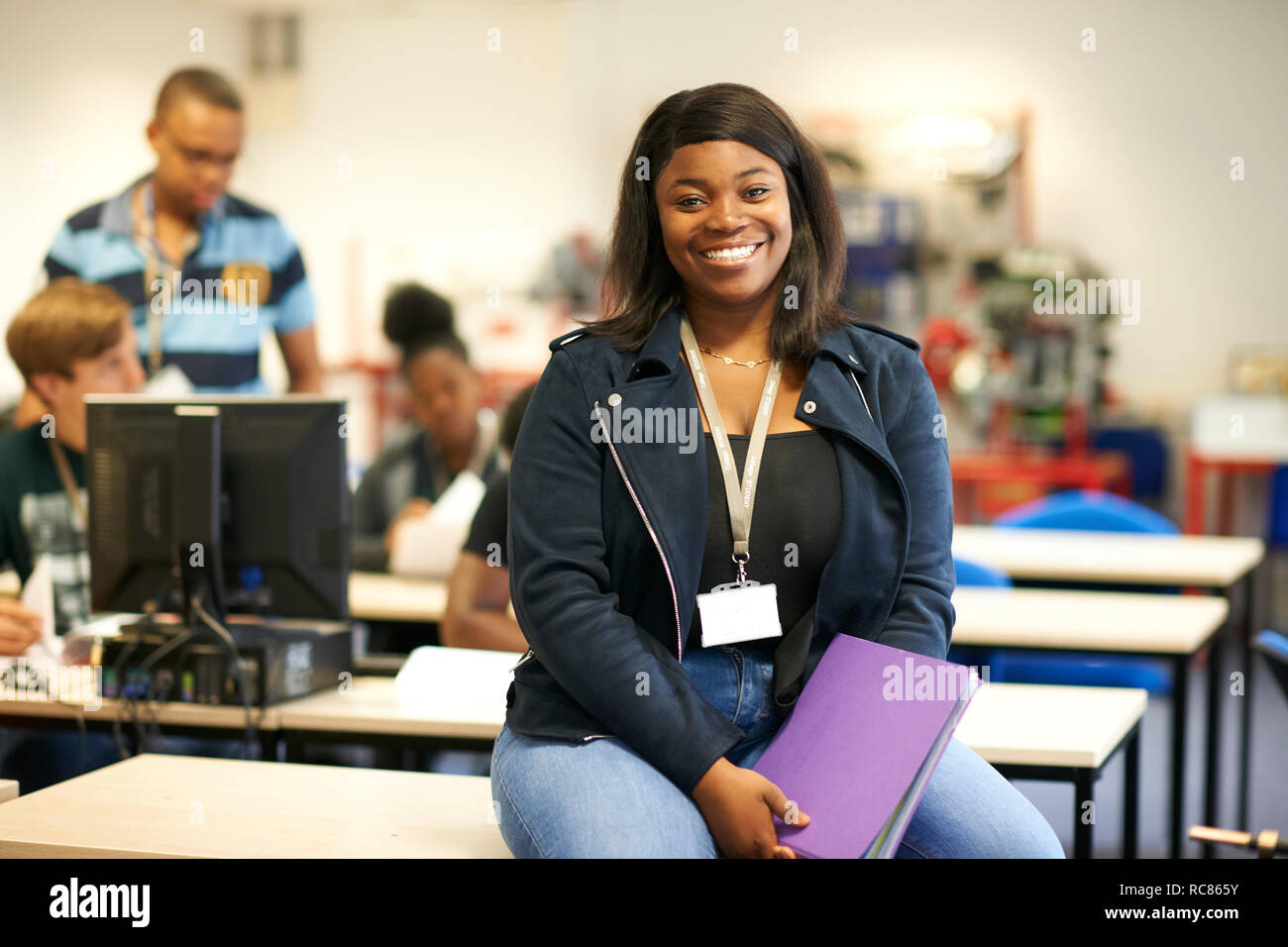 Young female higher education student in college classroom, portrait ...