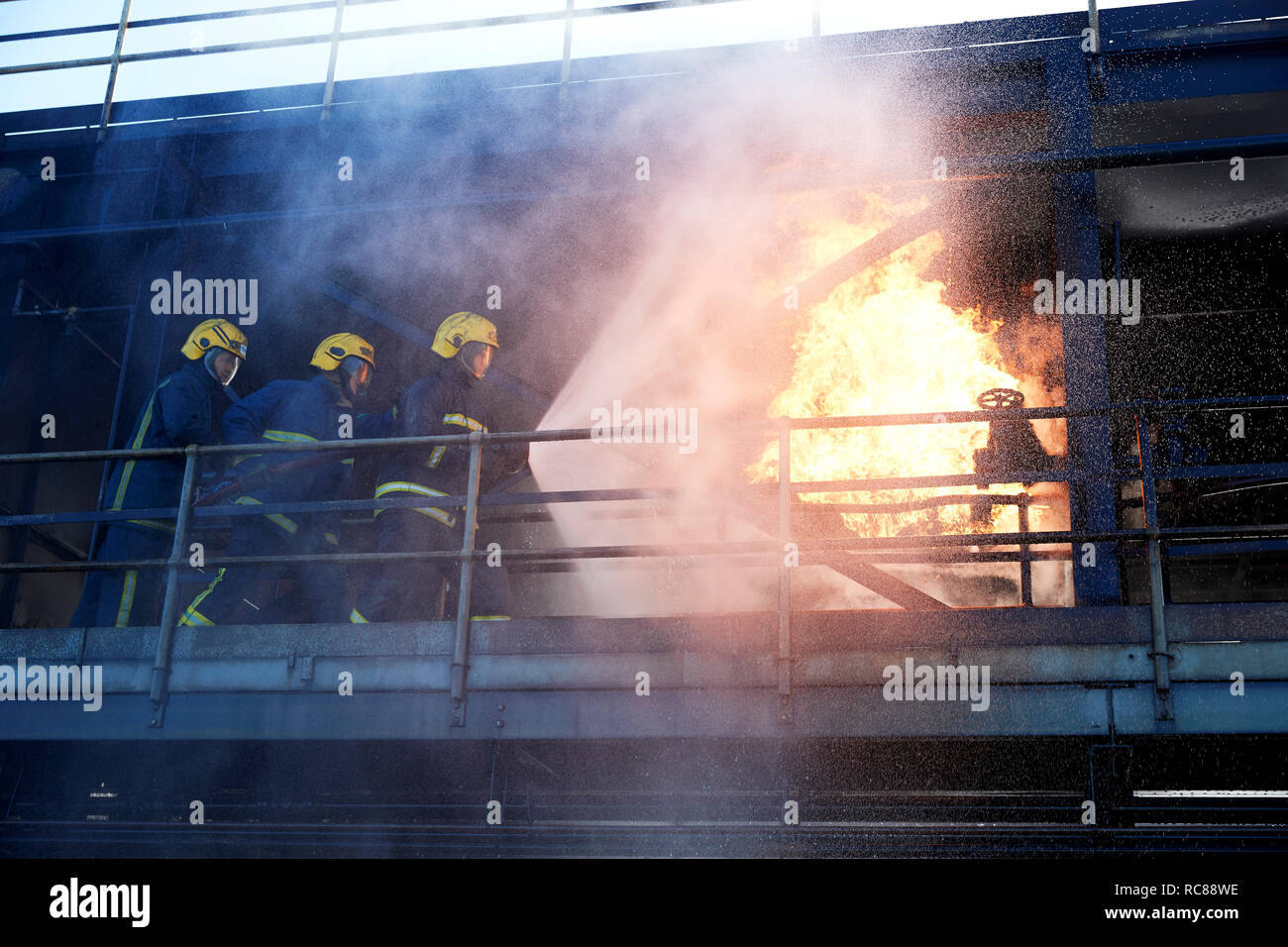 Firemen training to put out fire on burning building, Darlington, UK ...
