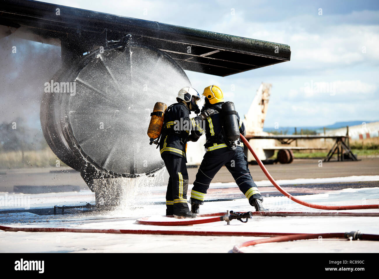 Putting out fire hi-res stock photography and images - Alamy
