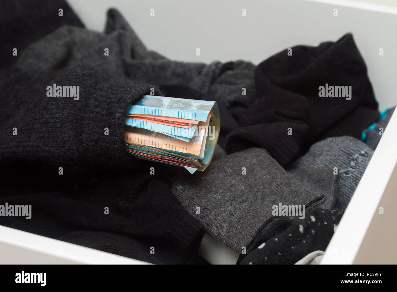 Hiding cash hi-res stock photography and images - Alamy