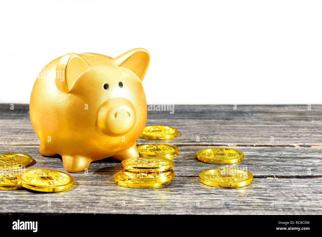 Piggy bank and golden coins on the wooden table. Chinese New Year. Year ...
