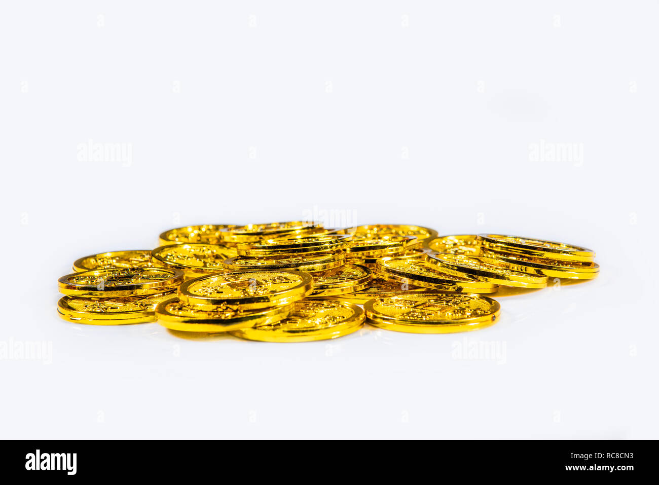 Pile of chinese coins isolated over white background Stock Photo - Alamy