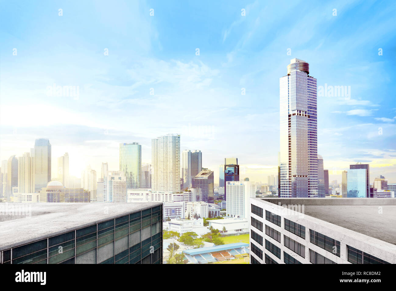 Modern city with high skyscrapers over blue sky background Stock Photo ...