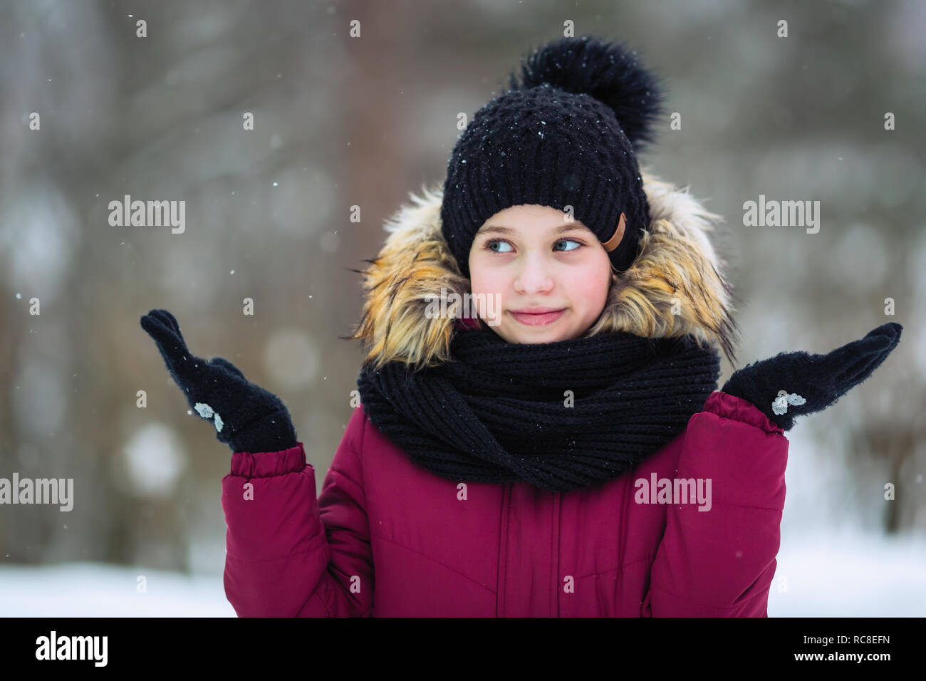 Portrait of cute little girl shrugs of outdoor at winter Stock Photo ...