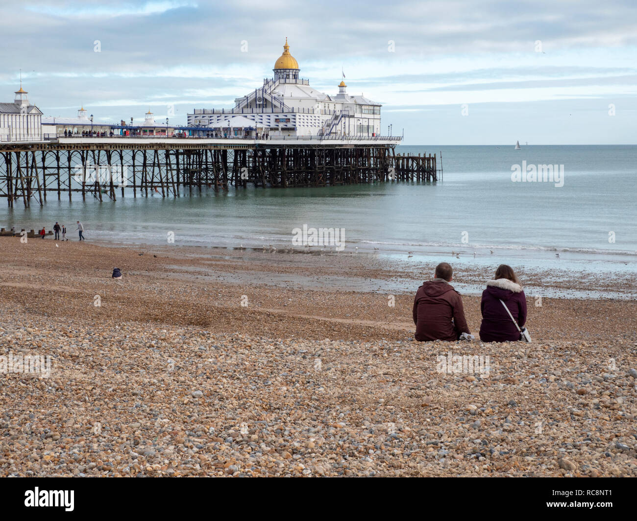A view of the beach, and pier on the seafront at the south coast seside ...