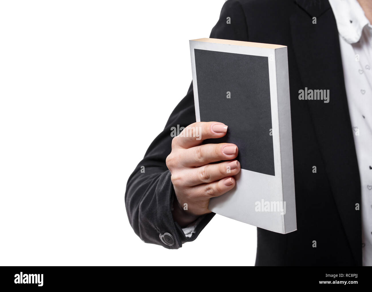 Hand holding book hi-res stock photography and images - Alamy