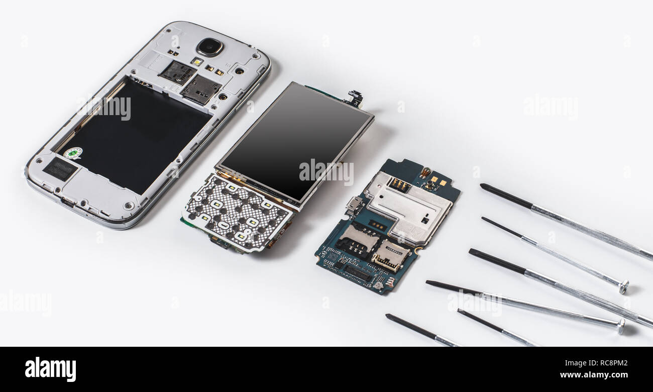 disassembled mobile phone and tools on white background Stock Photo - Alamy