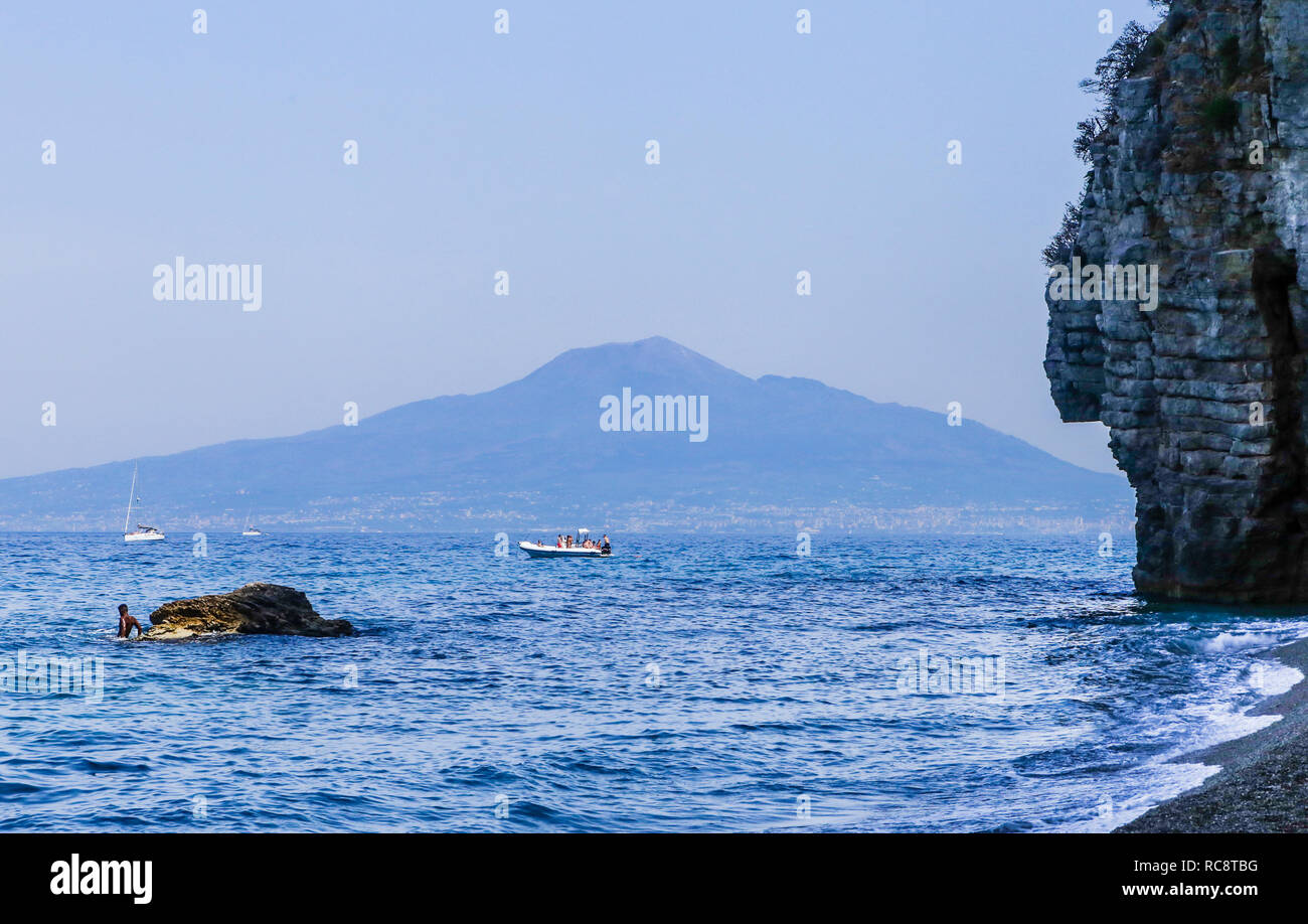 The beach on Amalfi Coast, the volcano Mount Vesuvius in the background ...