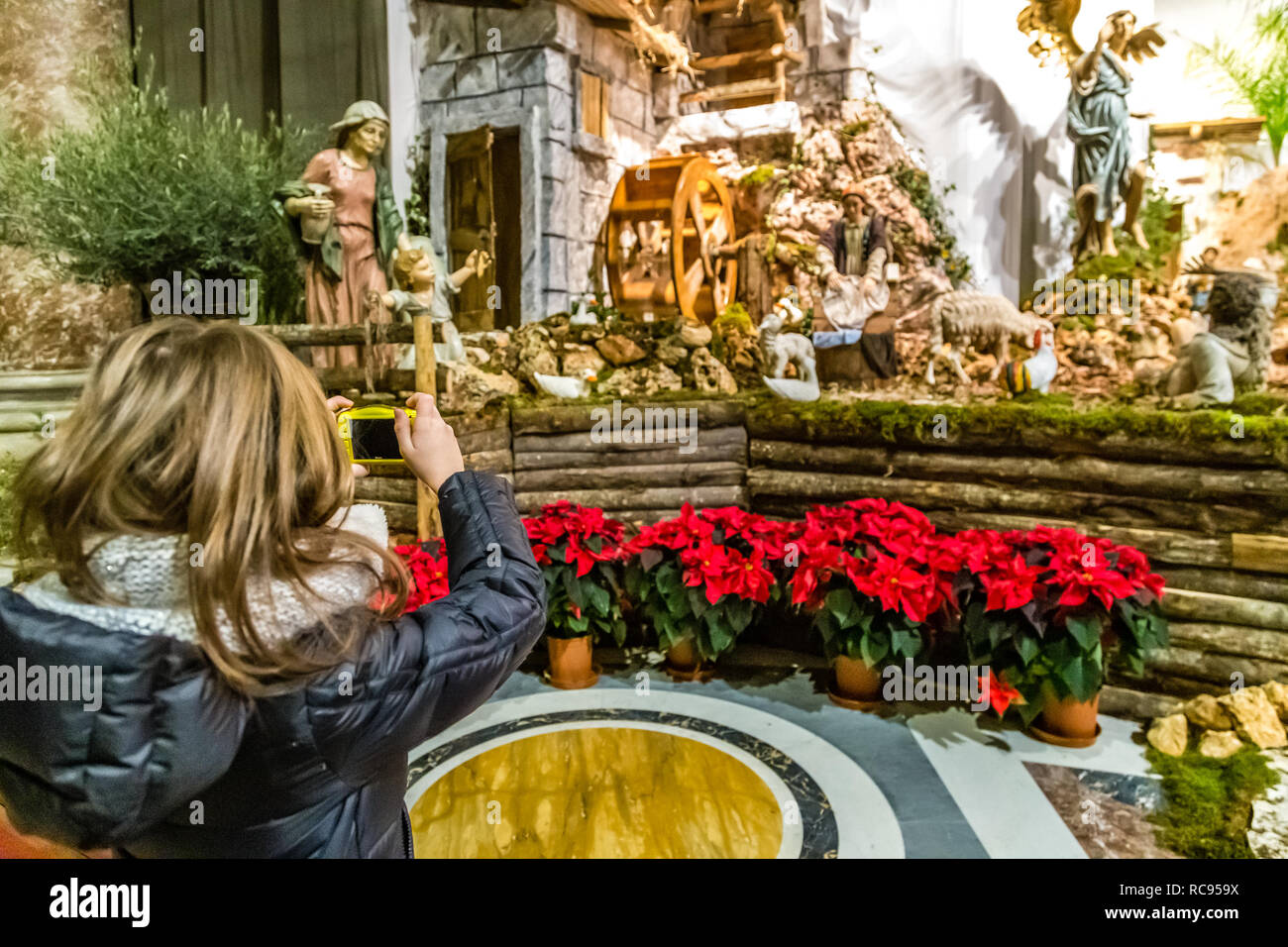 VATICAN - JANUARY 2, 2019: tourist taking photos of Christmas Nativity ...