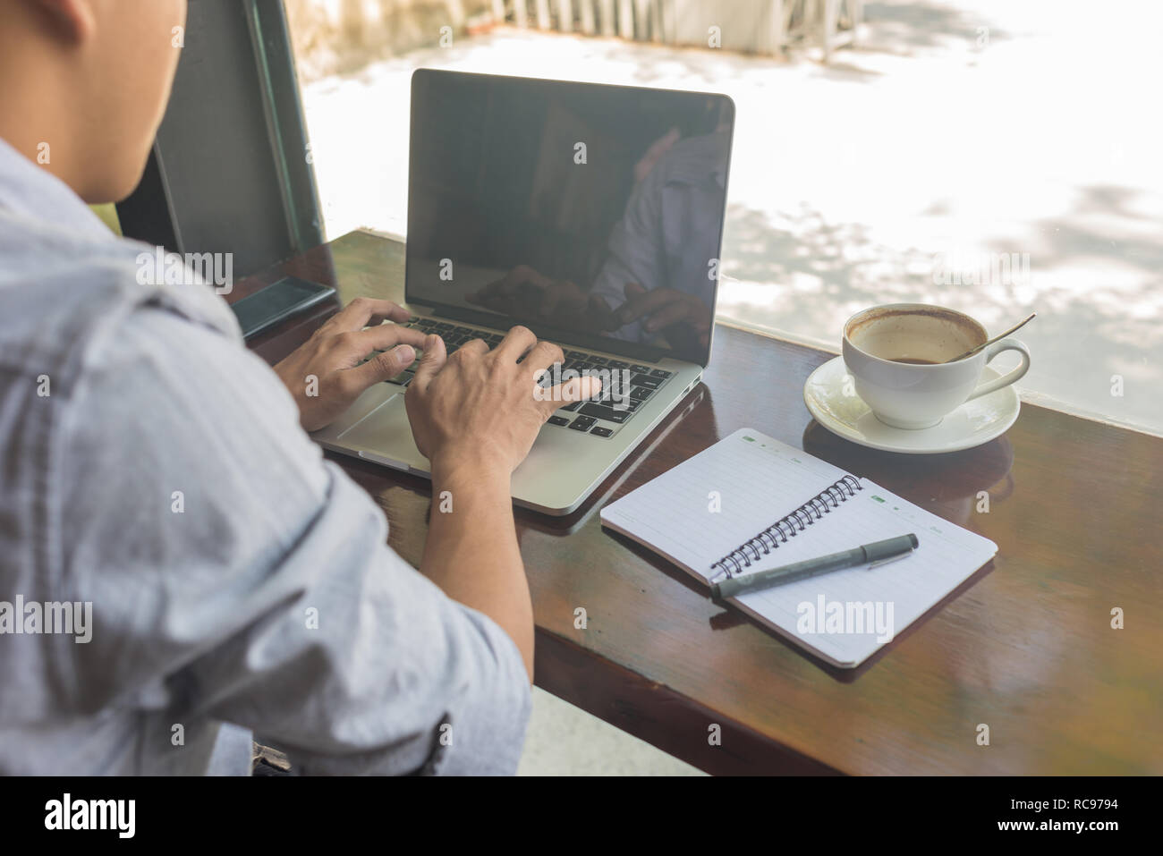 Young freelancer work online on laptop Stock Photo - Alamy