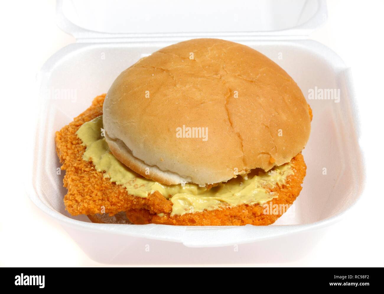 Fast food, bread roll with fried pork schnitzel Stock Photo - Alamy