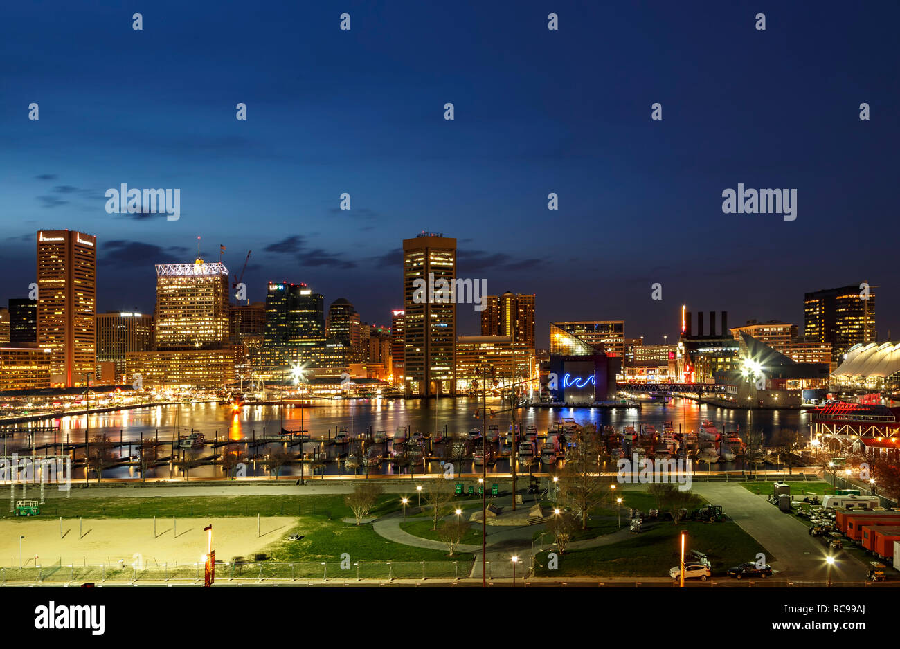 Baltimore Skyline at twilight and boats in marina, Inner Harbor ...