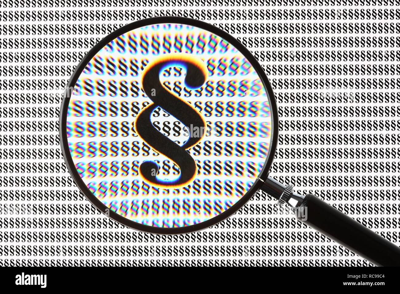 Section or paragraph symbol through a magnifying glass Stock Photo - Alamy