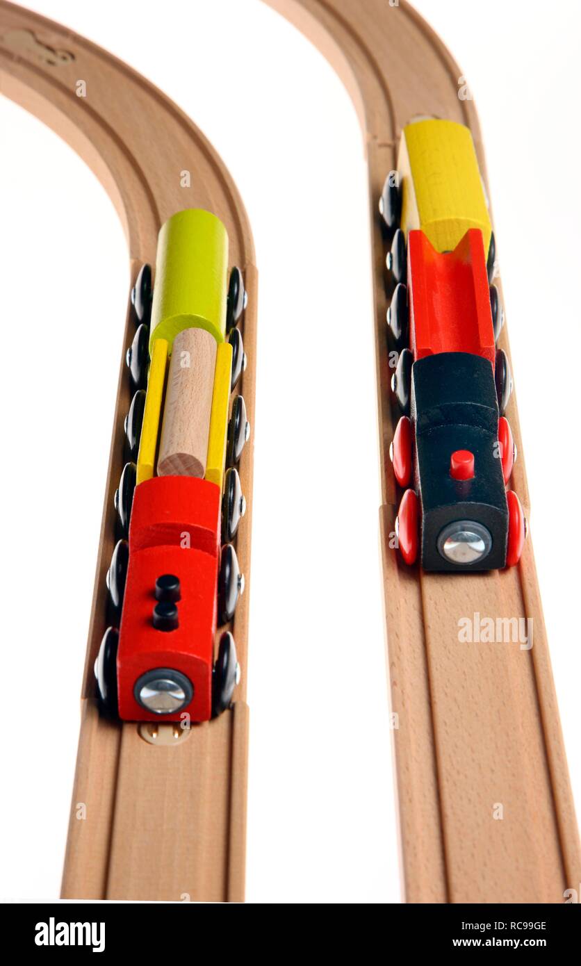 Toy wooden trains, two trains on the tracks, symbolic image of a race ...
