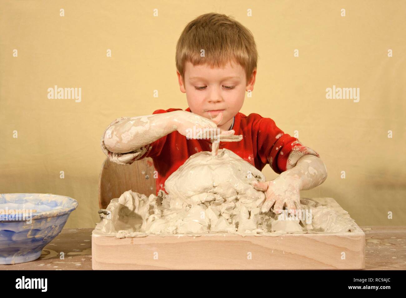 Boy doing art therapy with clay Stock Photo - Alamy