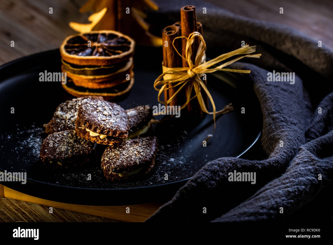 Horizontal photo of several brown sweets. Sweets are stuffed by cream ...