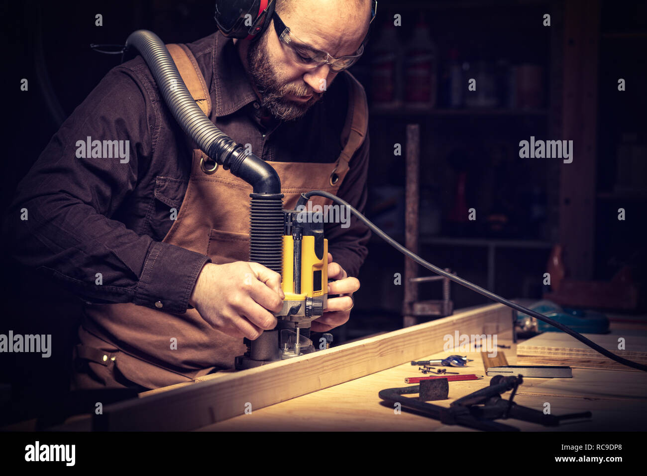 portrait of carpenter using a vertical router Stock Photo - Alamy