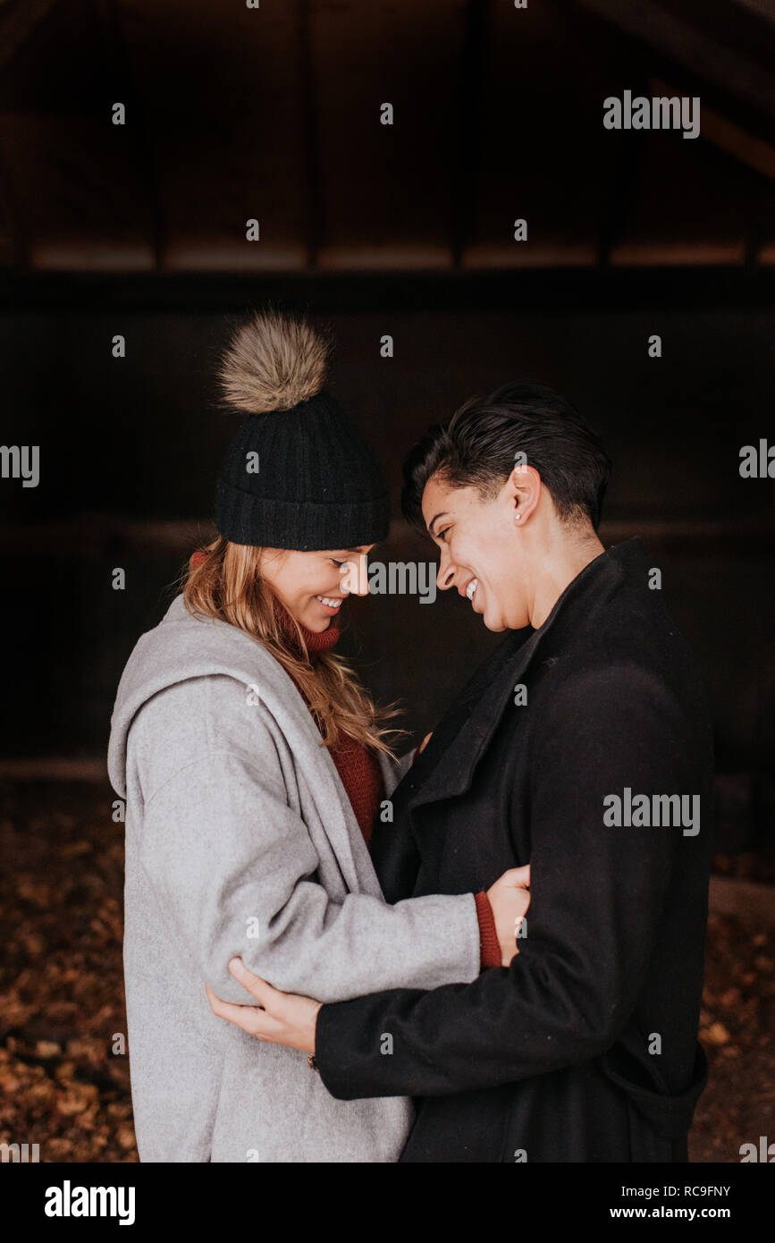 Happy couple enjoying romance and hugs Stock Photo - Alamy