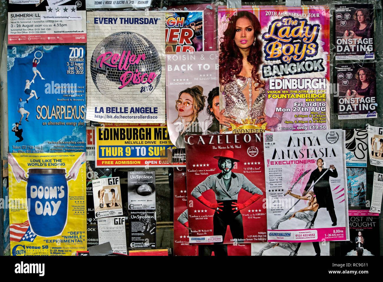 Posters stuck on the window of an empty shop advertising shows on the ...