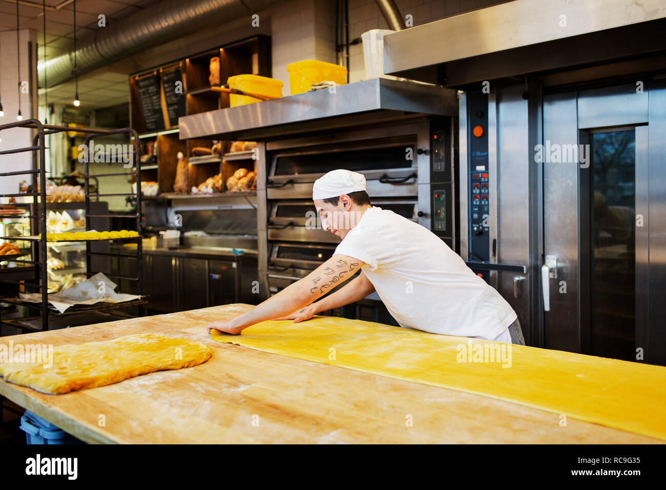Young man in bakery cafe hi-res stock photography and images - Alamy