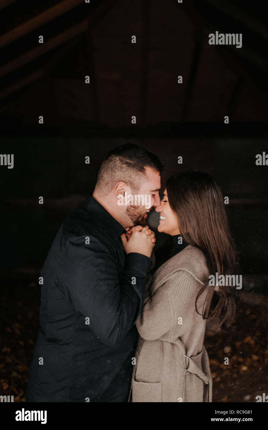 Young couple happy hugging night hi-res stock photography and images ...