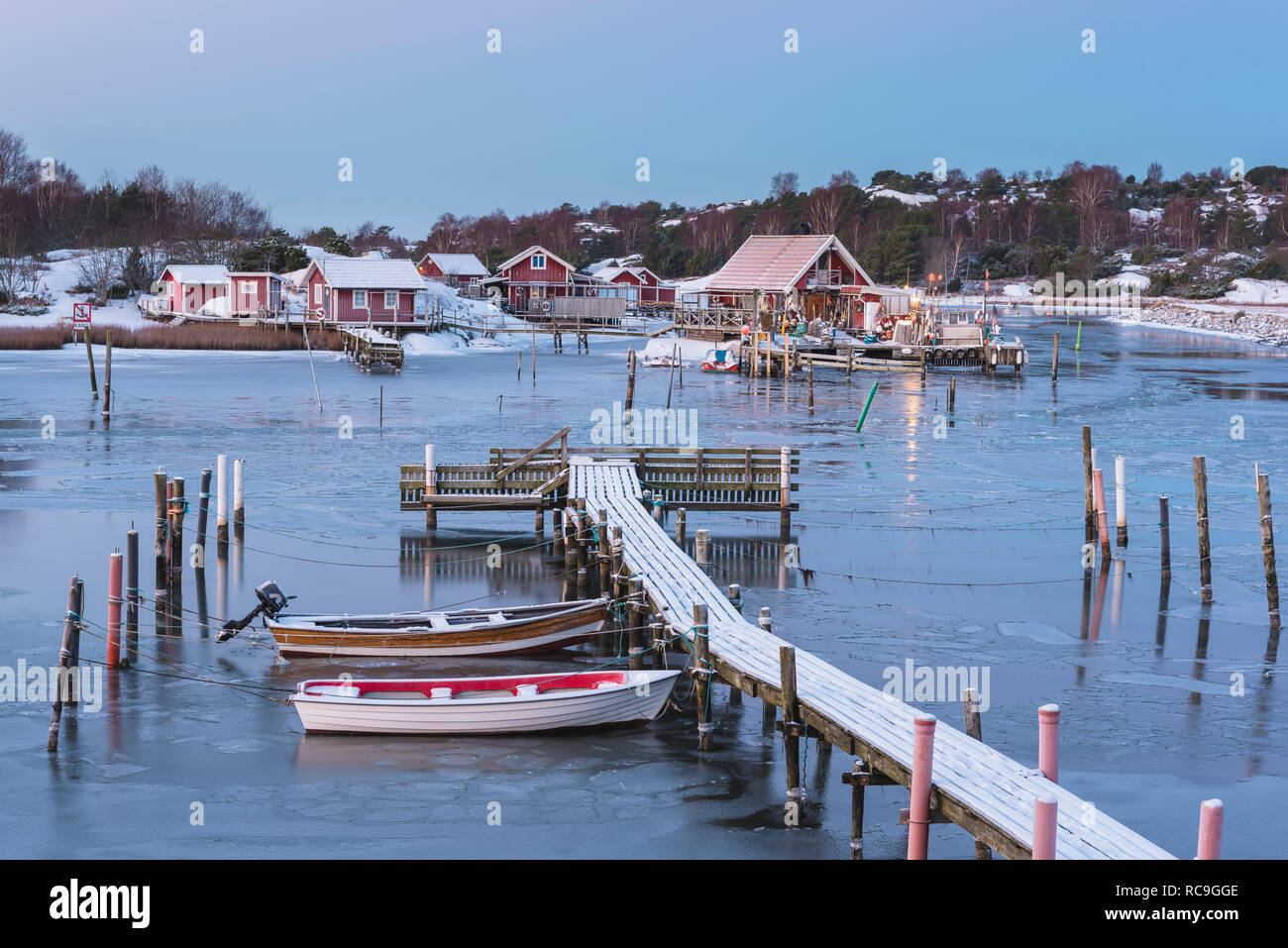 Pier in harbor covered with snow Stock Photo - Alamy