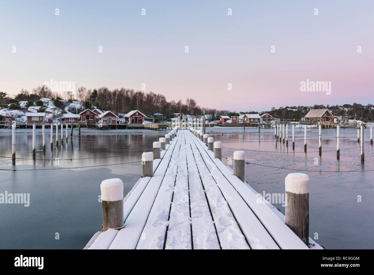 Pier in harbor covered with snow Stock Photo - Alamy