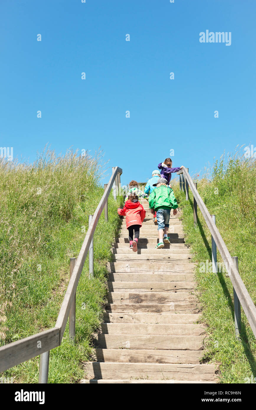 Children walking up stairs Stock Photo - Alamy
