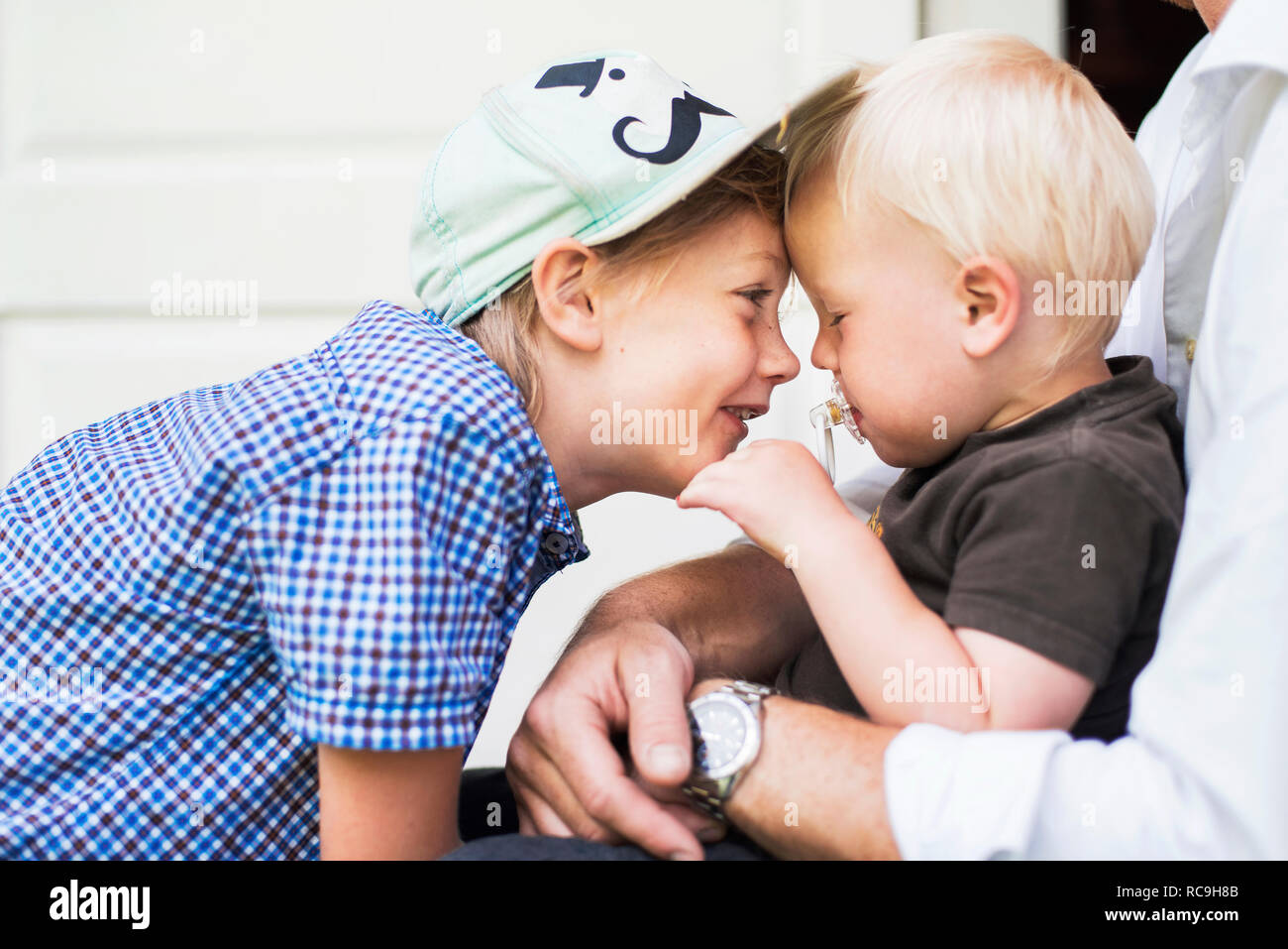 Brothers playing together Stock Photo - Alamy