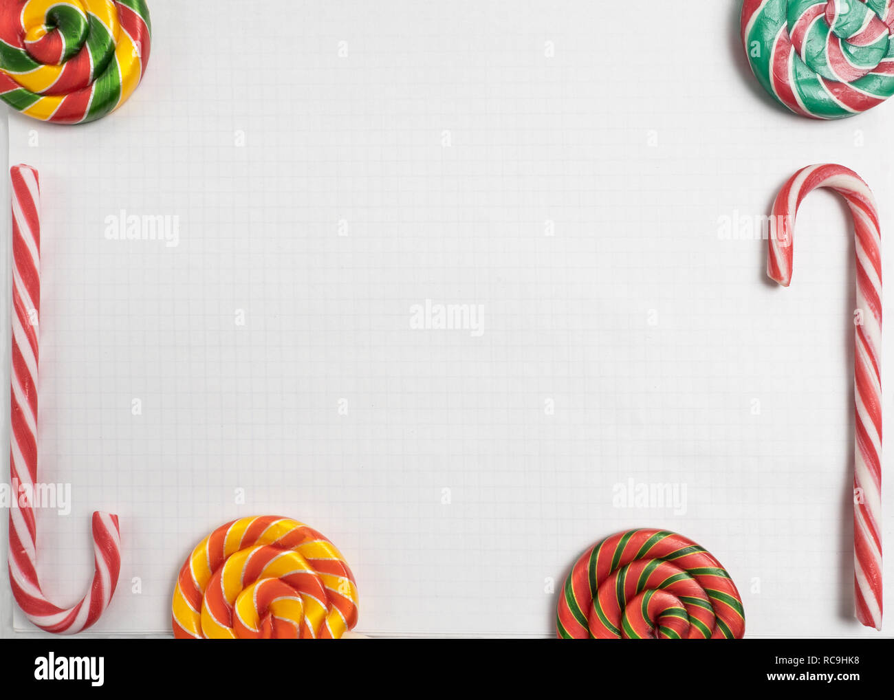 colorful sweet candys on blank notepad. striped Candy Canes and spiral ...