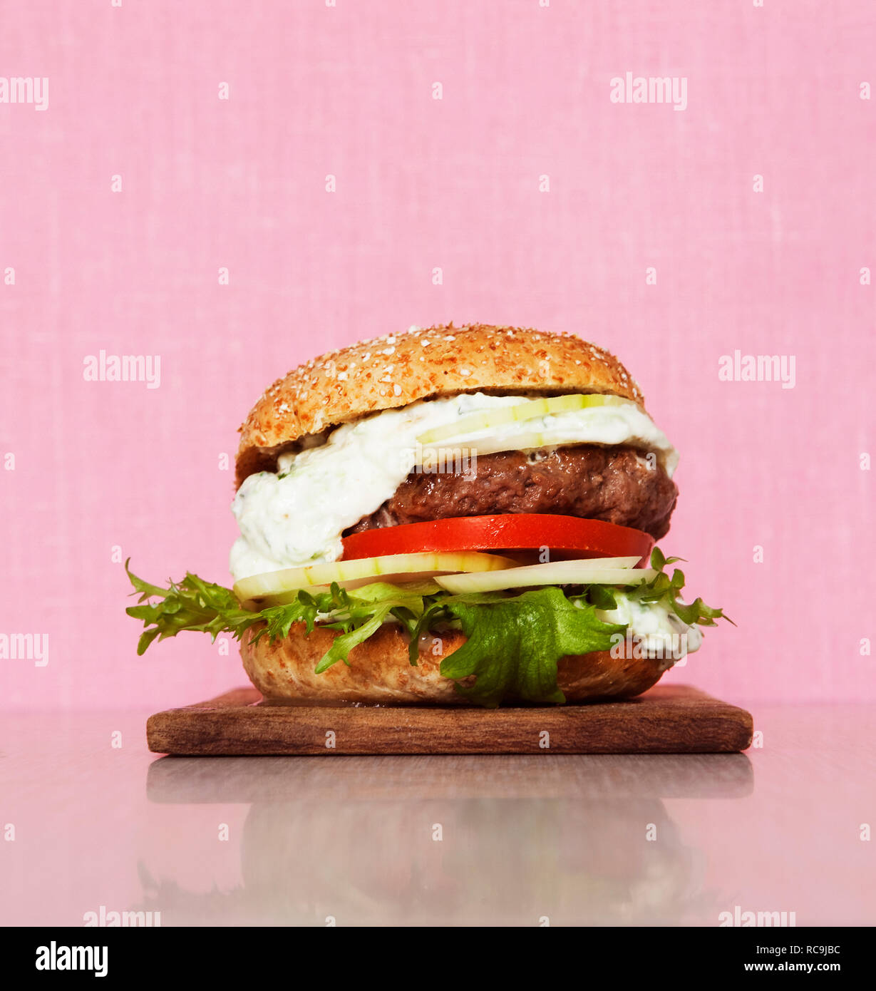 Burger on pink background Stock Photo - Alamy