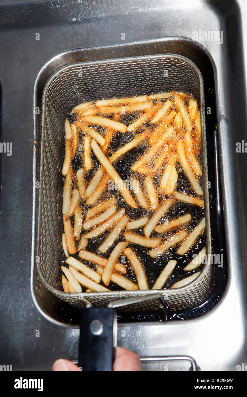 Frying chips oil hi-res stock photography and images - Alamy