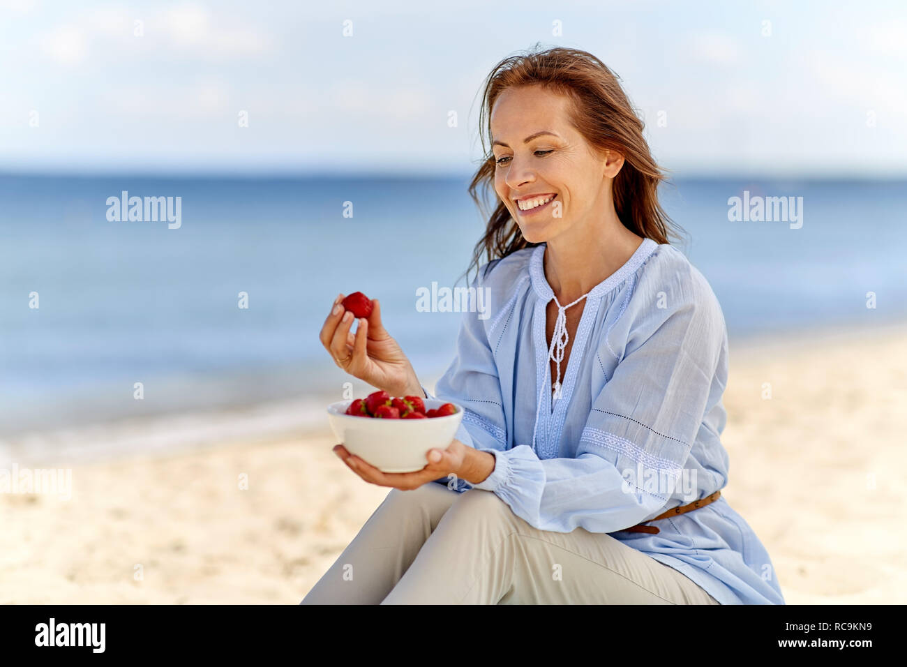 Woman berry eating hi-res stock photography and images - Alamy