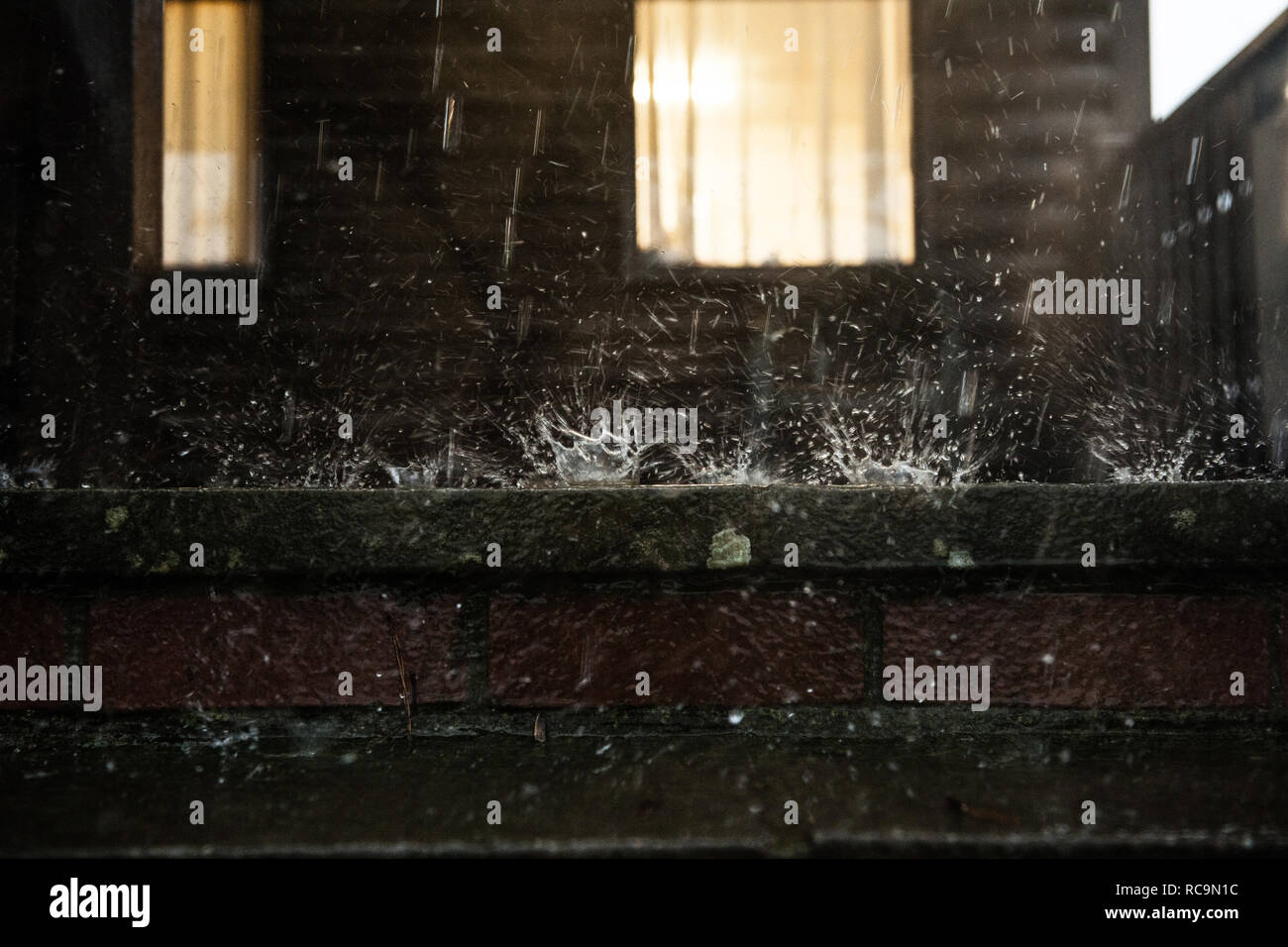 rain falling on patio Stock Photo - Alamy