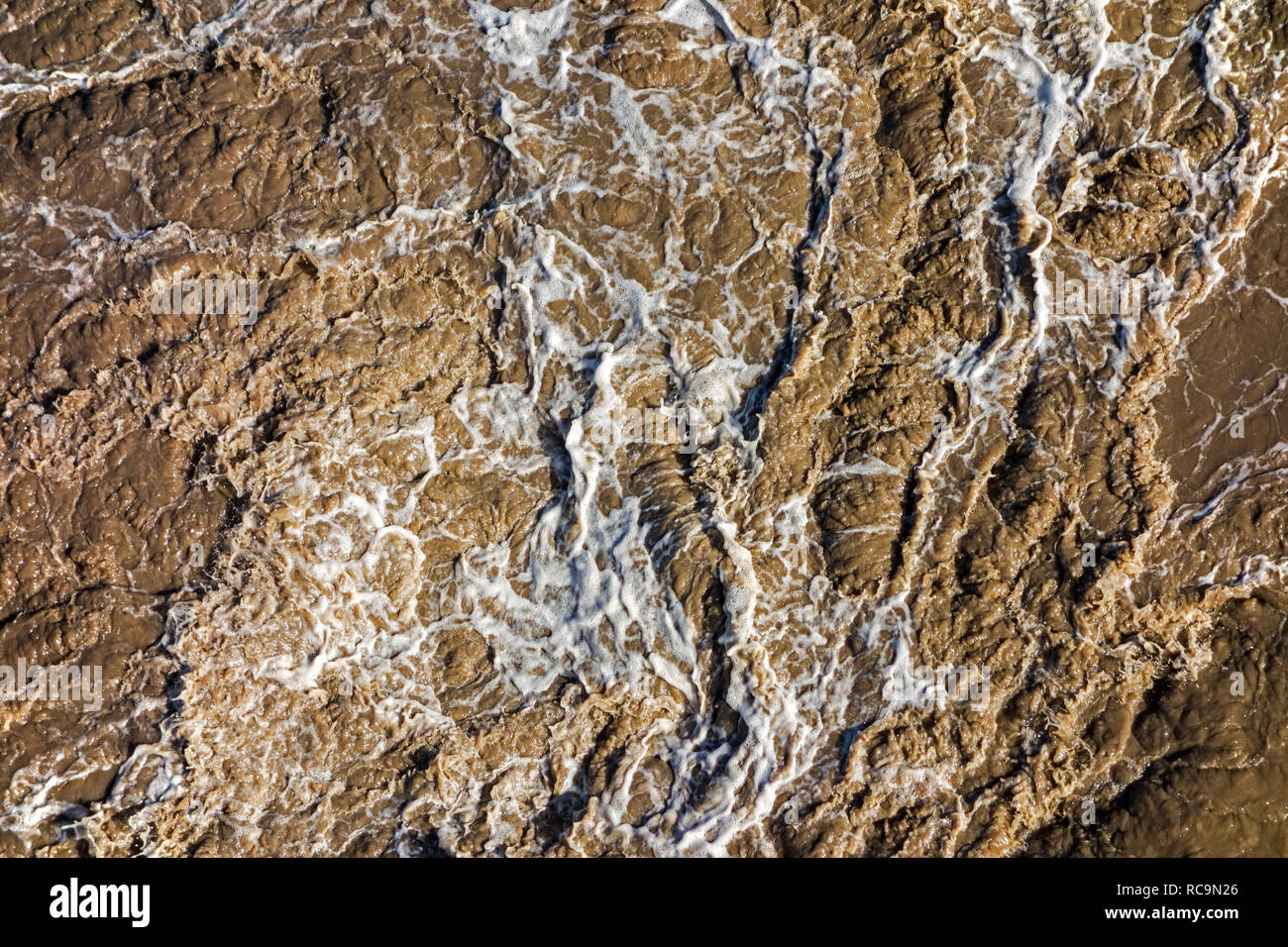 Turbulent muddy sea water caused by ship's screw causing turmoil in ...