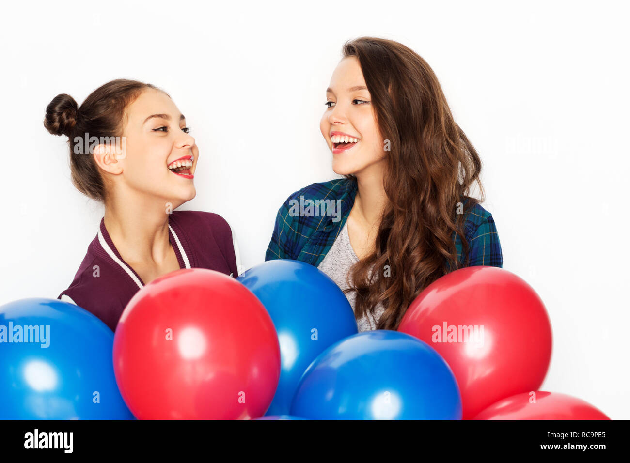 happy teenage girls with helium balloons Stock Photo - Alamy